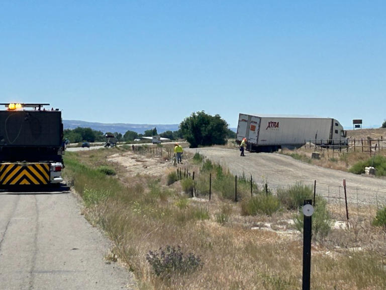 Semi-truck veers off I-70 onto access road