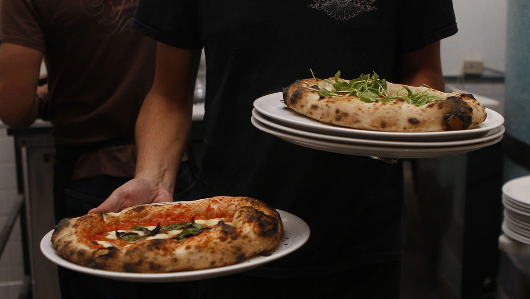 14 American cities celebrating unique pizza traditions