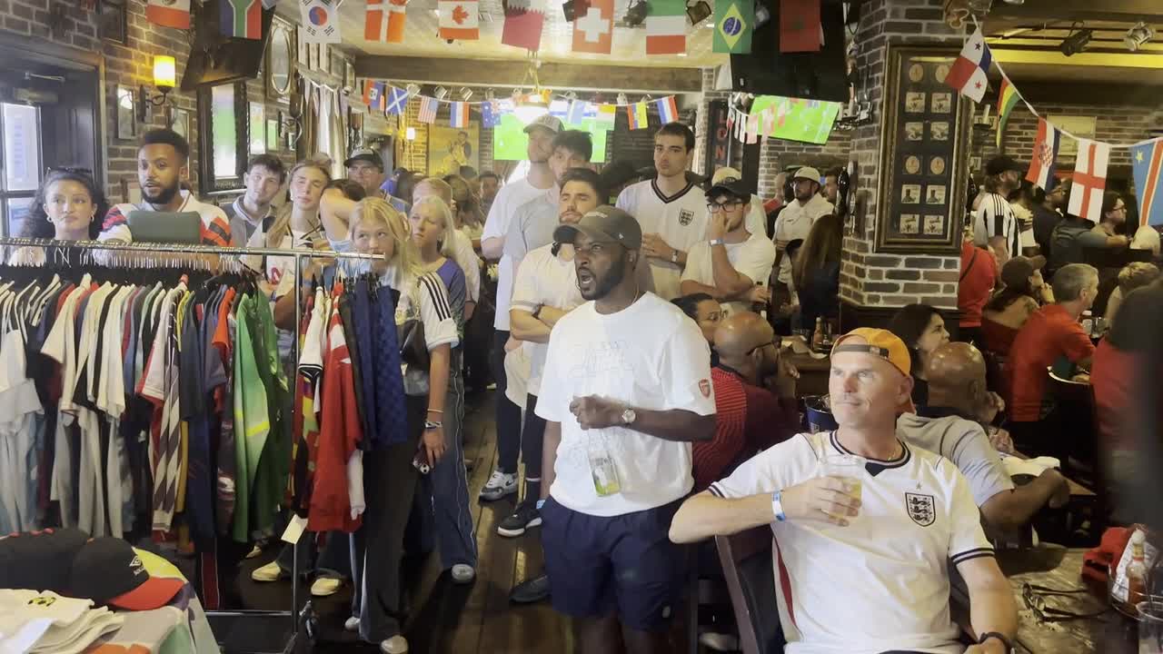 Fans of England's World Cup watching game Croatia vs England at the bar ...
