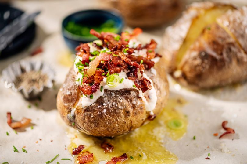 Baked potatoes will have crispy skin every time if you cover them with ...