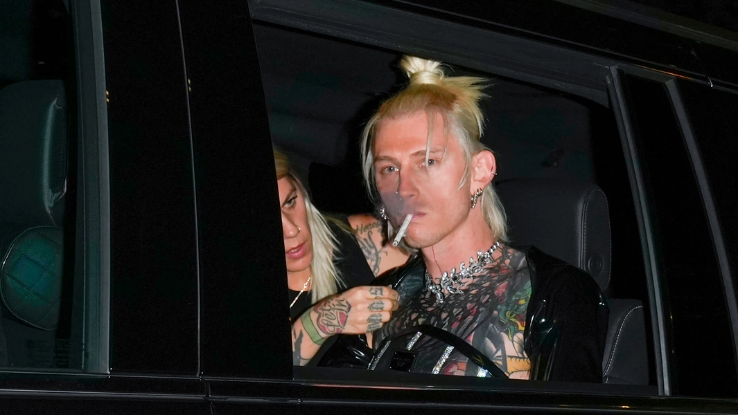 Machine Gun Kelly's extreme blackout tattoo transformation