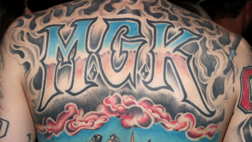 Machine Gun Kelly's extreme blackout tattoo transformation