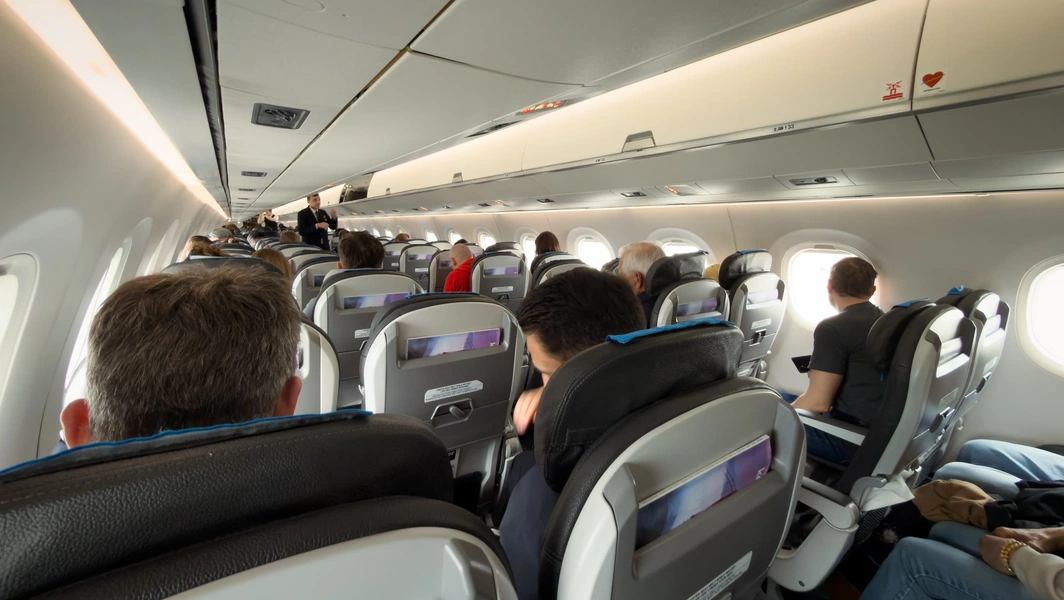 Why airplanes require open window shades