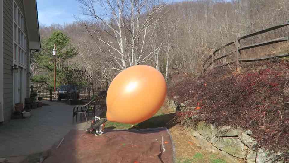Why this pop sounds like a gunshot… giant balloon explosion in slow motion