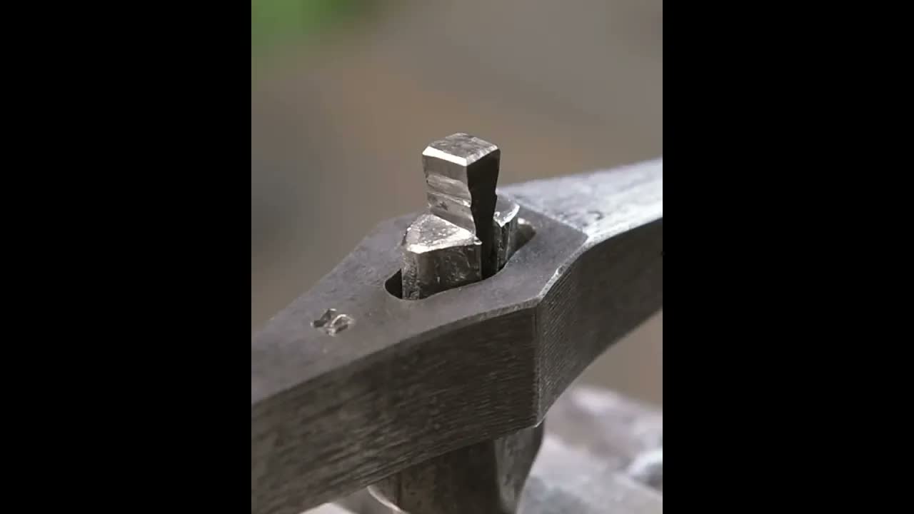 Turning a steel wedge into a working hammer handle