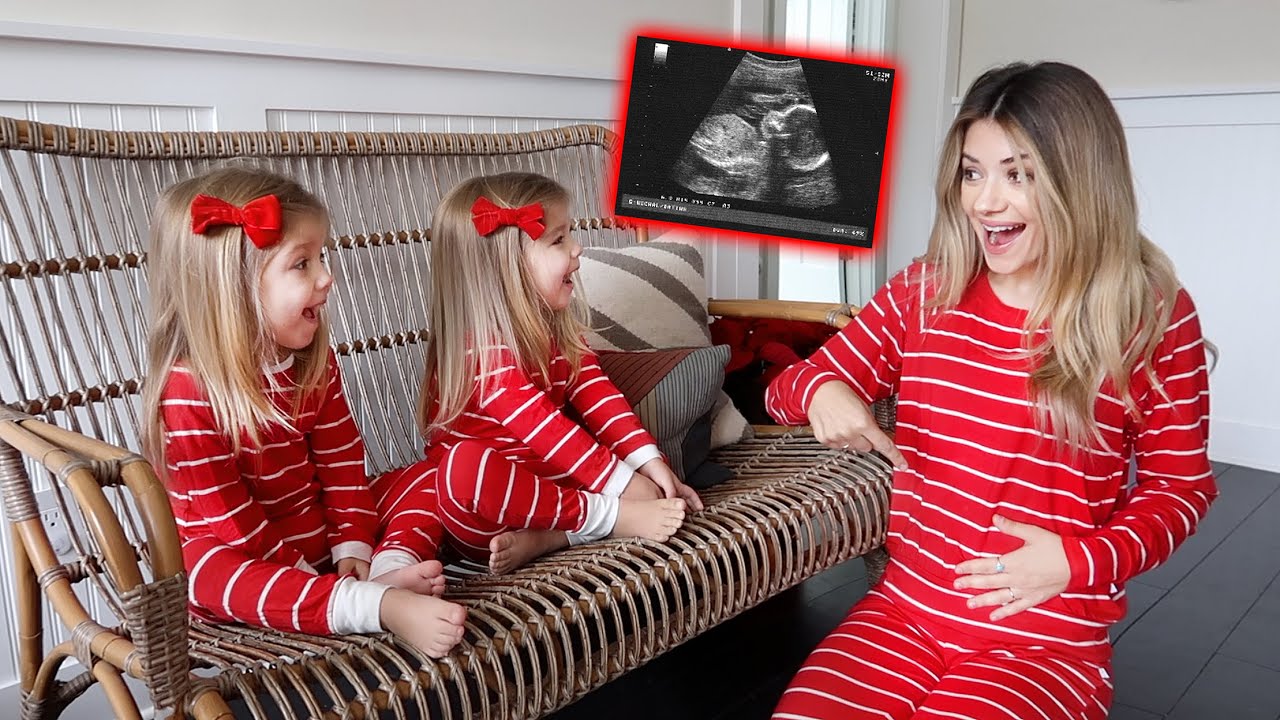 Parents share exciting pregnancy news with their young twins