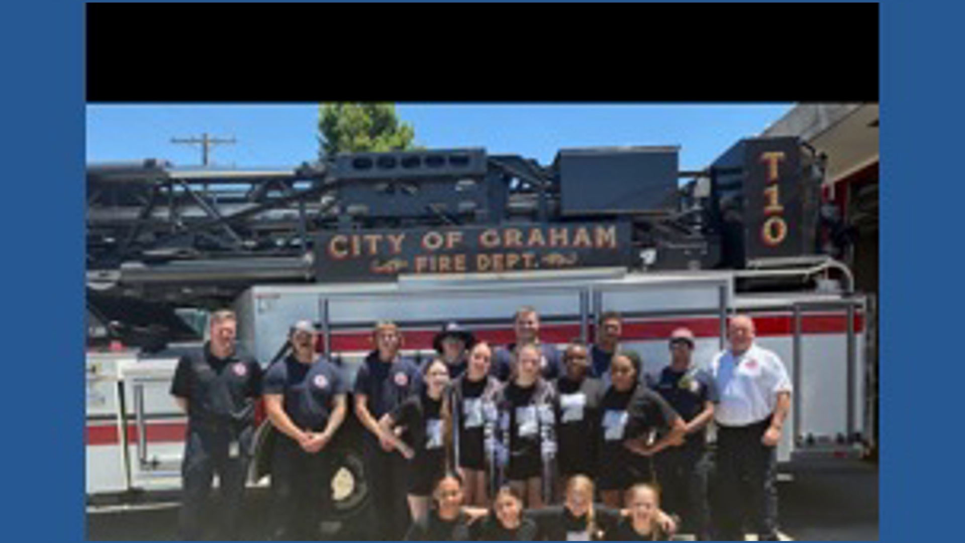 Cheer squad helps Graham Fire wash trucks