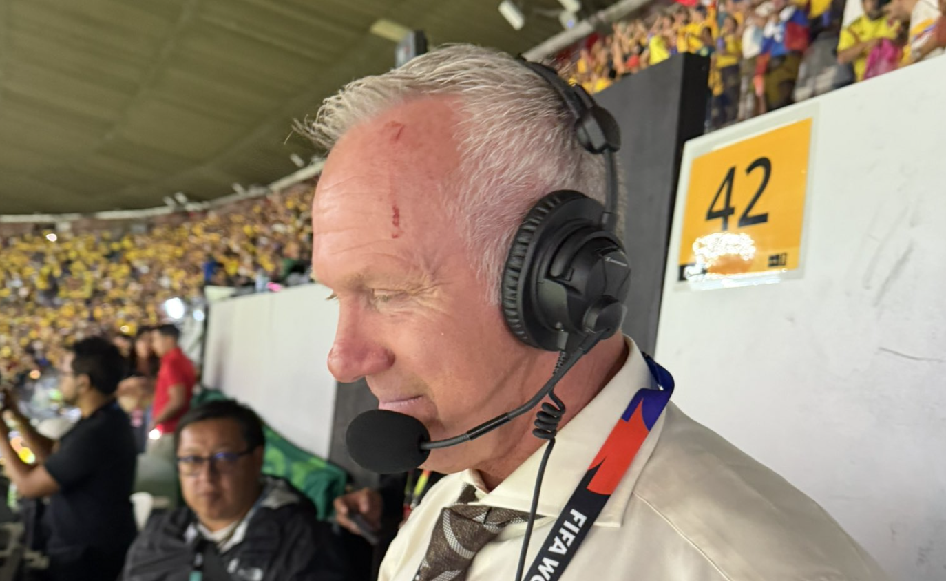 World Cup commentator hit with flying object during match