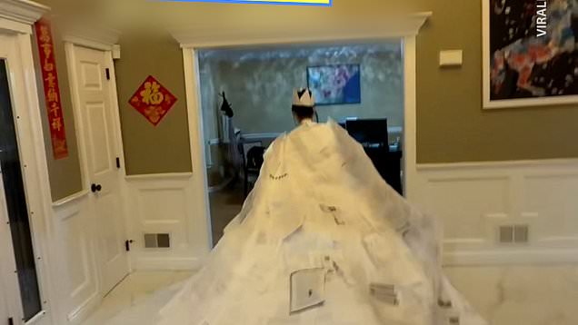 Student turns her past papers into giant cape