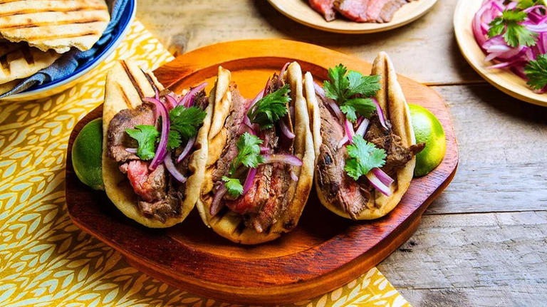 For the flakiest, most delicate way to serve tacos, use a warm piece of ...