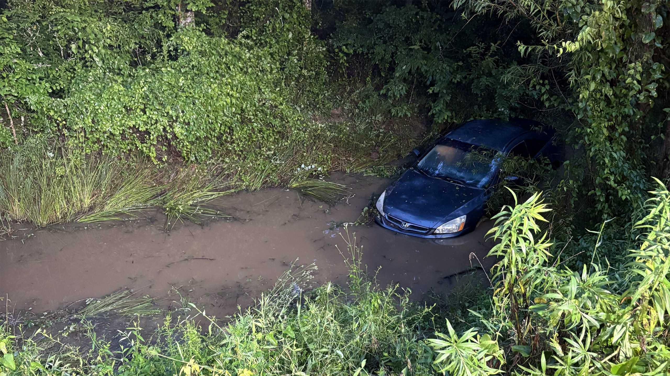 Teen escapes water-filled ditch as heavy rain and flooding threaten ...