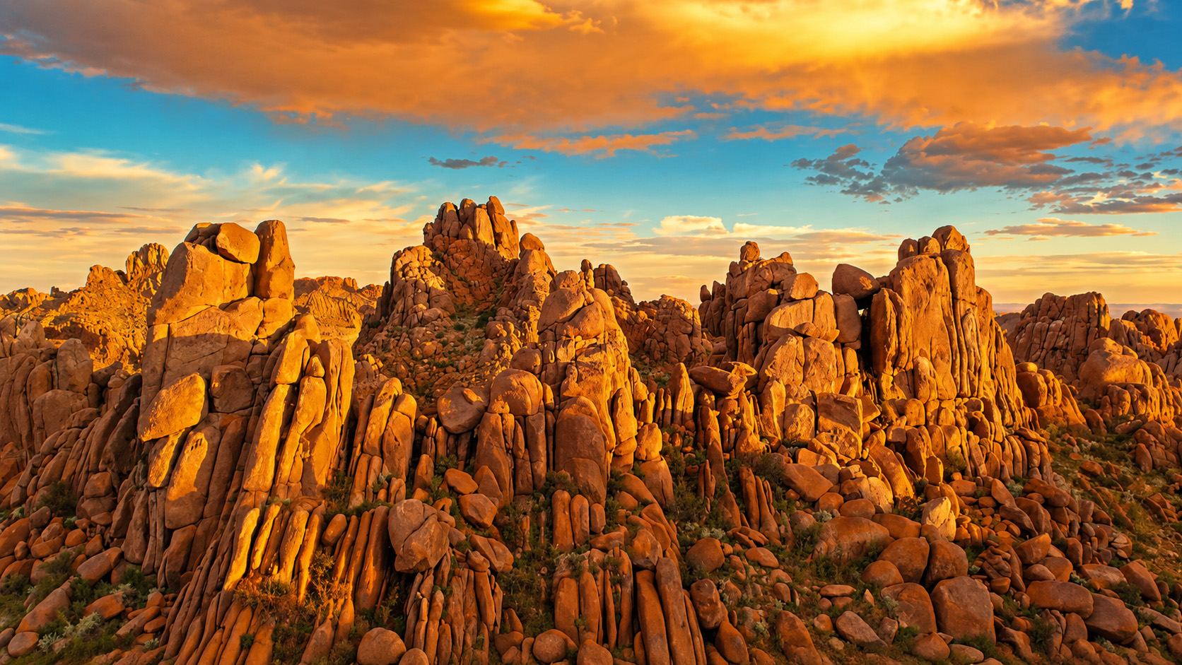 Red Rock Canyon’s sandstone cliffs glowing at golden hour