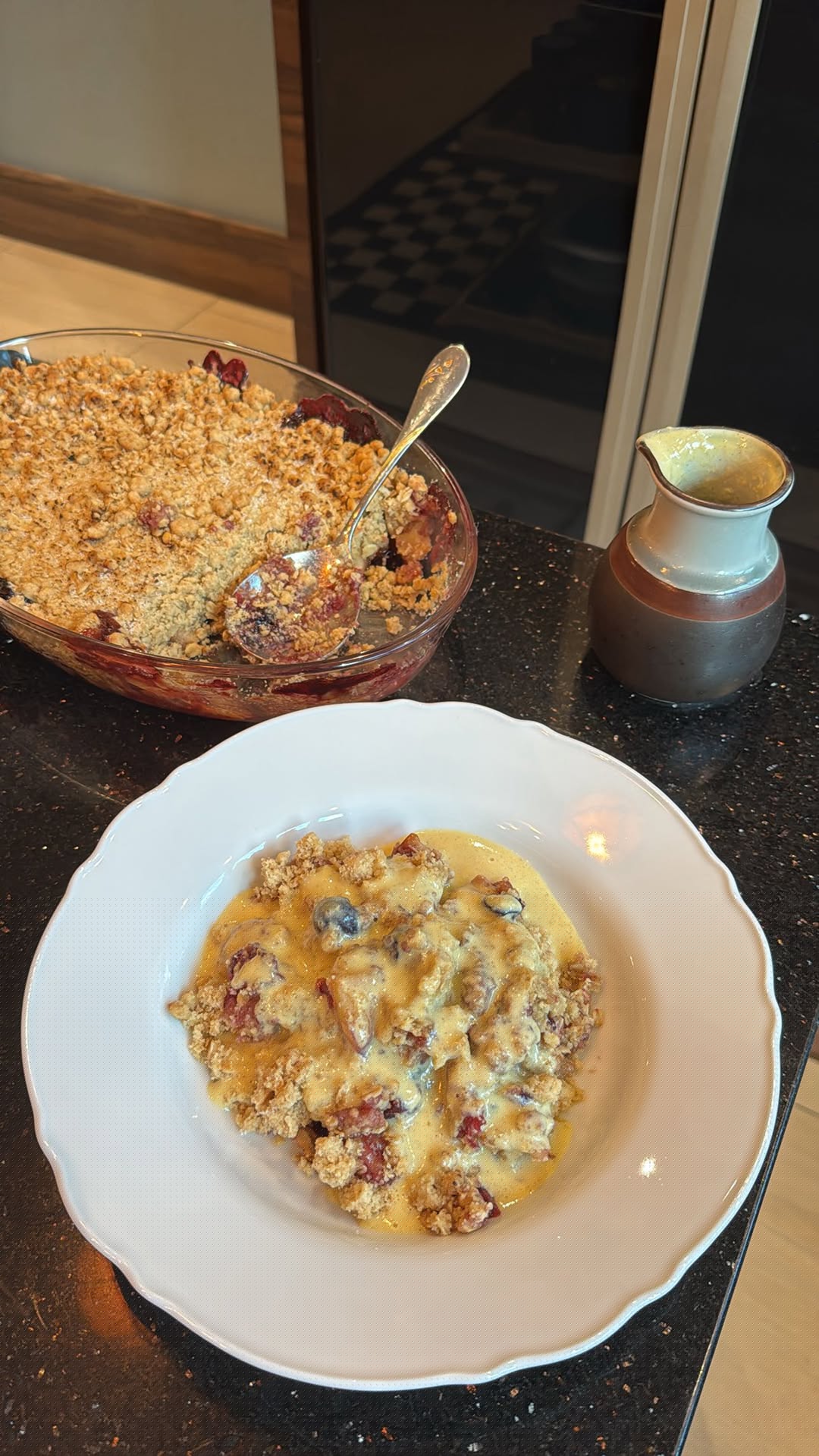 Homemade apple crumble with creamy custard sauce