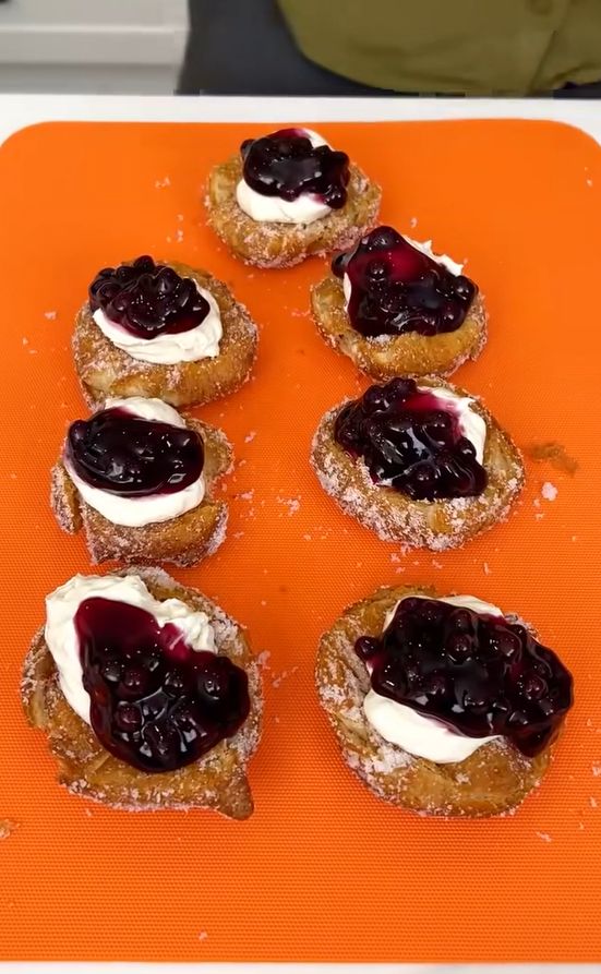 Deep fried dessert with cheesecake topping and blueberries