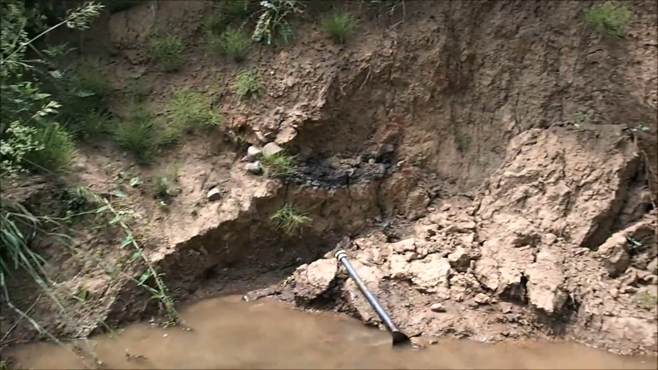 A creek wall hid burned clay, 'cooking pit,' then he realized it could ...
