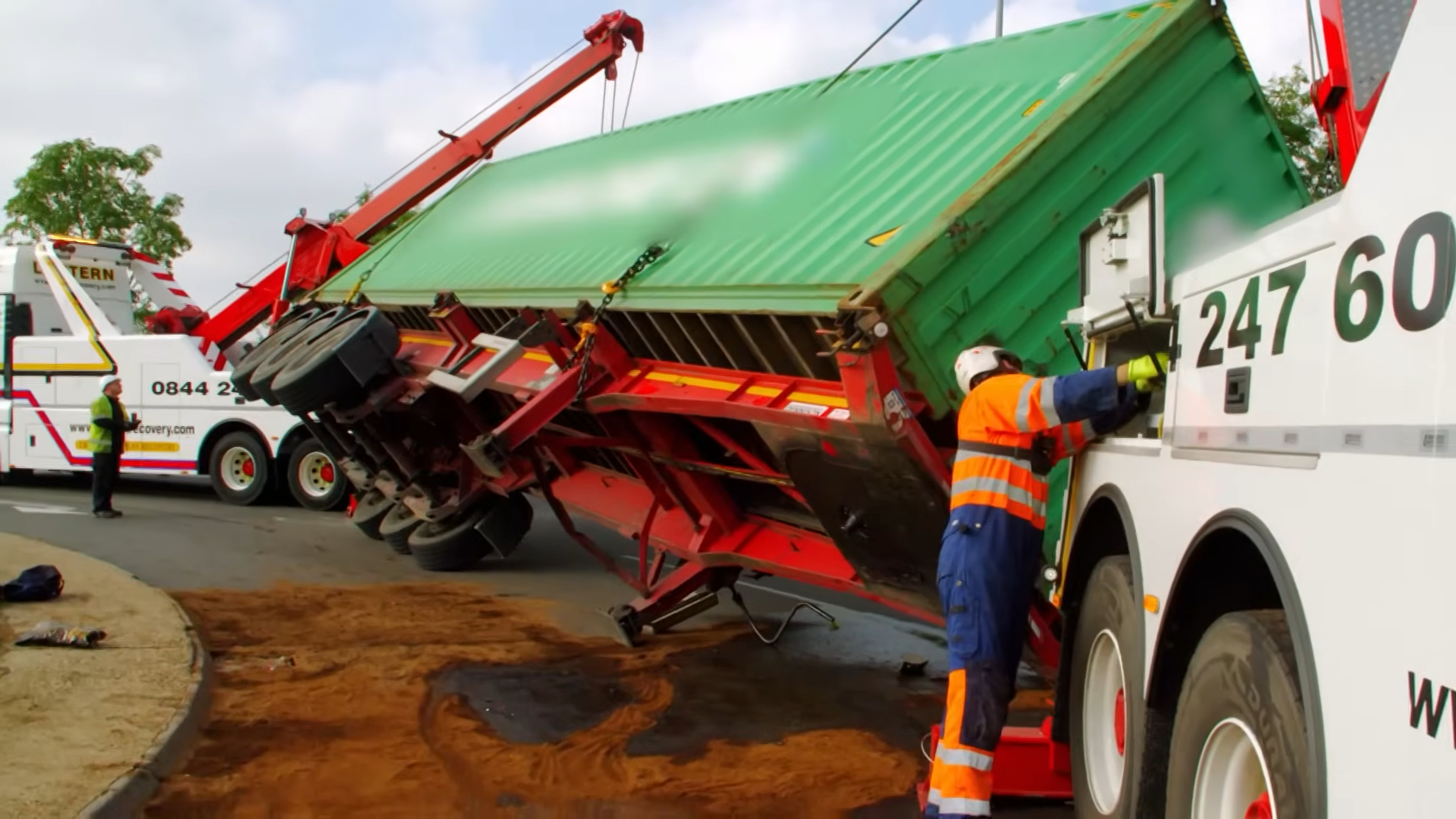 Watch a 30-ton trailer recovery go sideways when a chain lets go