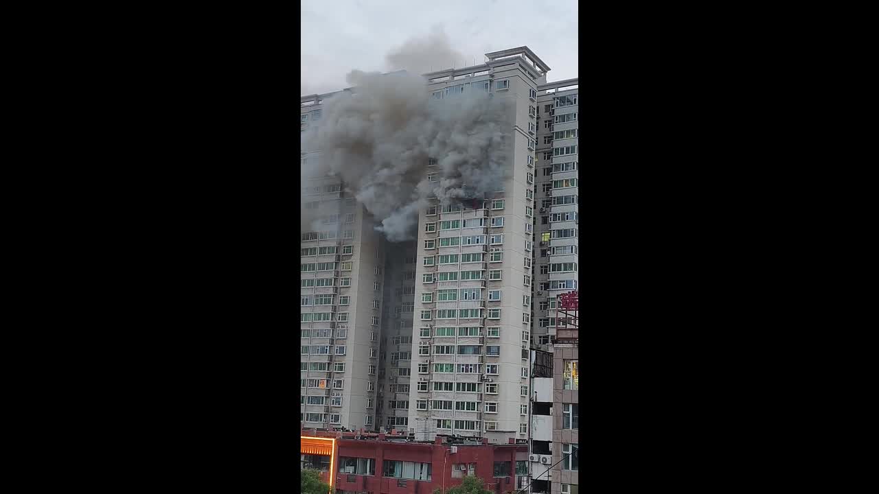 High-rise apartment fire sends thick smoke over residential tower in ...