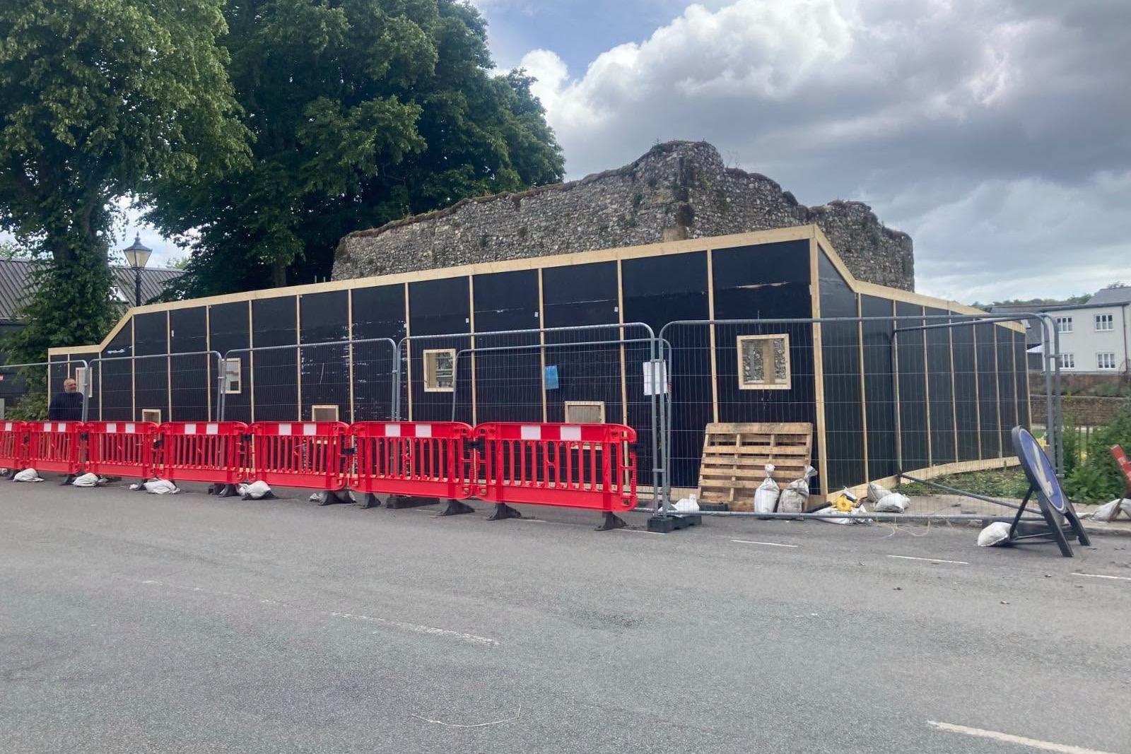 Council defends Arundel Priory ruins hoarding after MP brands it an ...