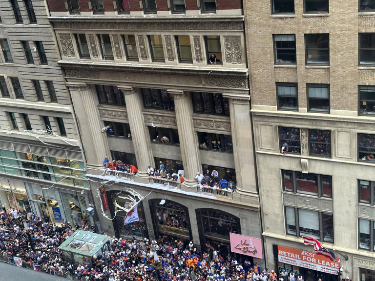The hottest office perk in NYC today: a front-row view of the Knicks parade