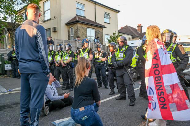 Convicted woman pictured with Tommy Robinson flag during Southampton ...
