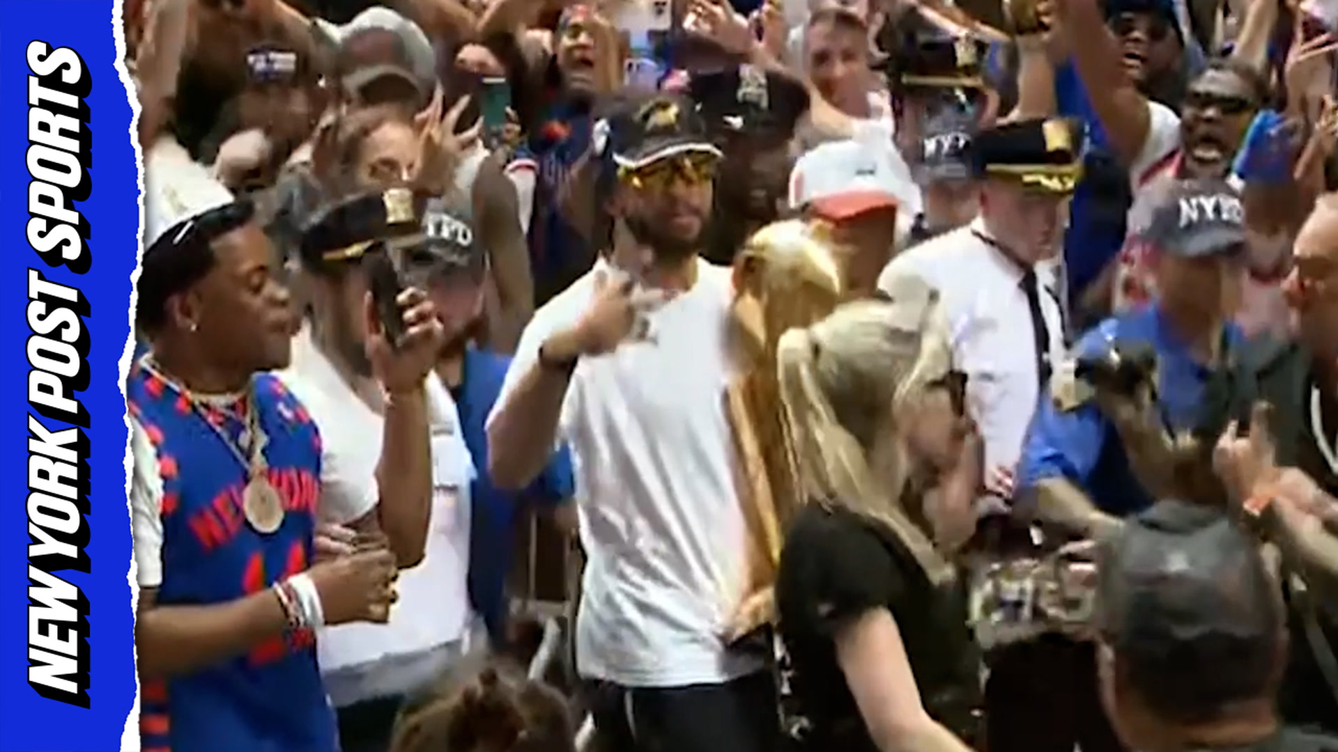 Jalen Brunson walks with Larry O'Brien trophy
