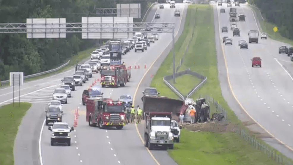 Dump truck overturns on Hwy 31 causing sand spill; 1 injured