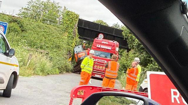 Heritage rail line suspended after lorry hits bridge