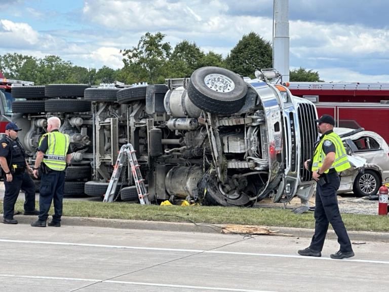 Dump truck rollover in Appleton, one vehicle pinned