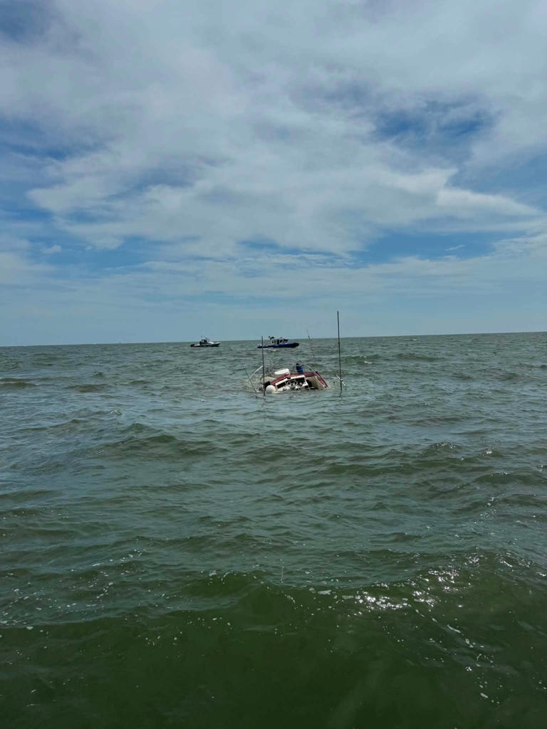 Emergency crews respond to sunken boat off Shore Road in Clinton