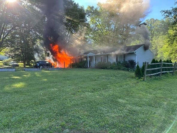 Mom escapes home with baby as fire burns garage