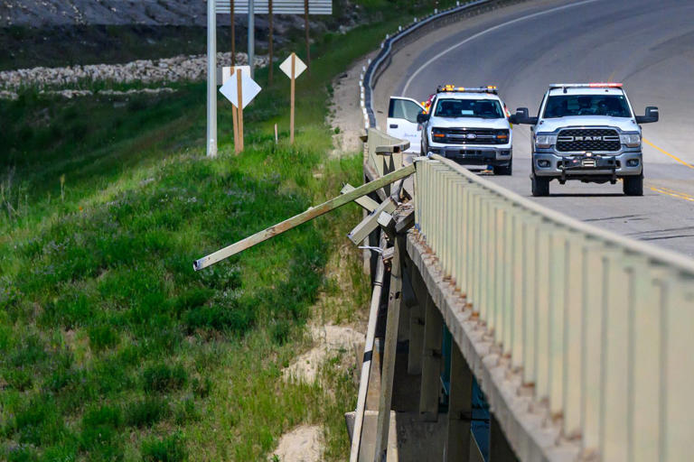 Driver missing after crane goes over bridge and into river in northern ...