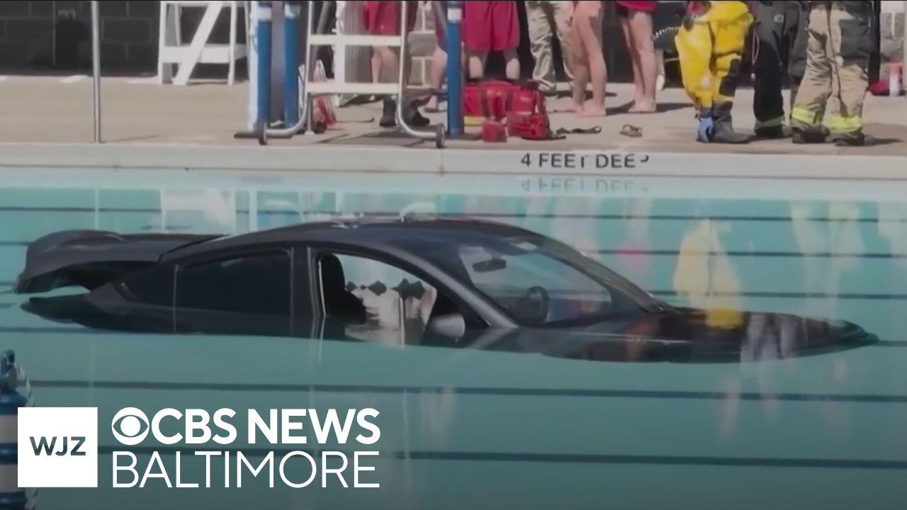Lifeguard and police rescue man who drove into swimming pool