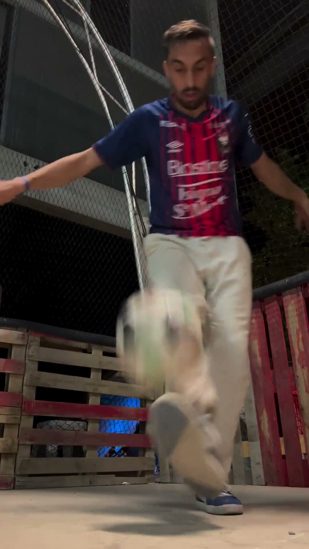 Man is showing off his freestyle football skills!
