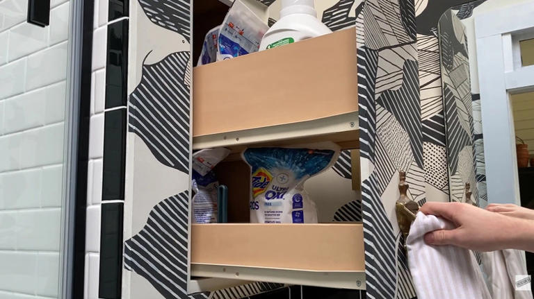 Turn an old kitchen cabinet into clever hidden bathroom storage