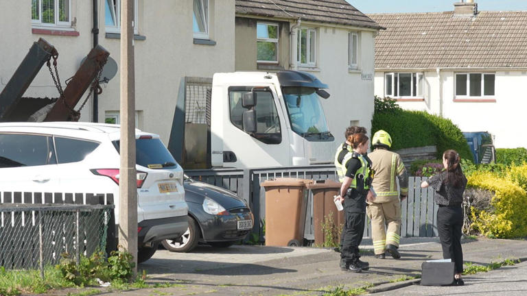 Four men arrested after skip lorry crashed into house