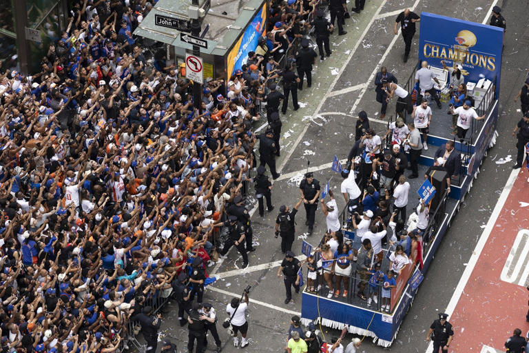 NYC Knicks parade packs downtown with fans, cops, confetti