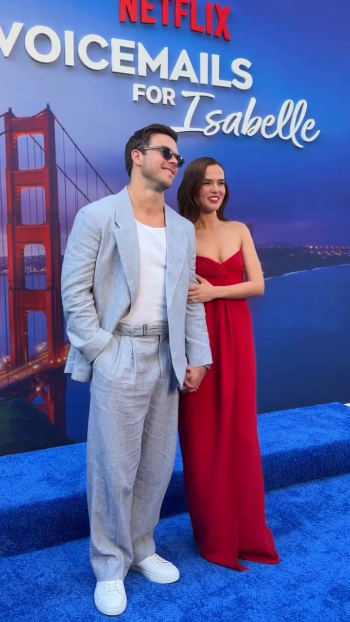 Zoey Deutch and Nick Robinson on the blue carpet