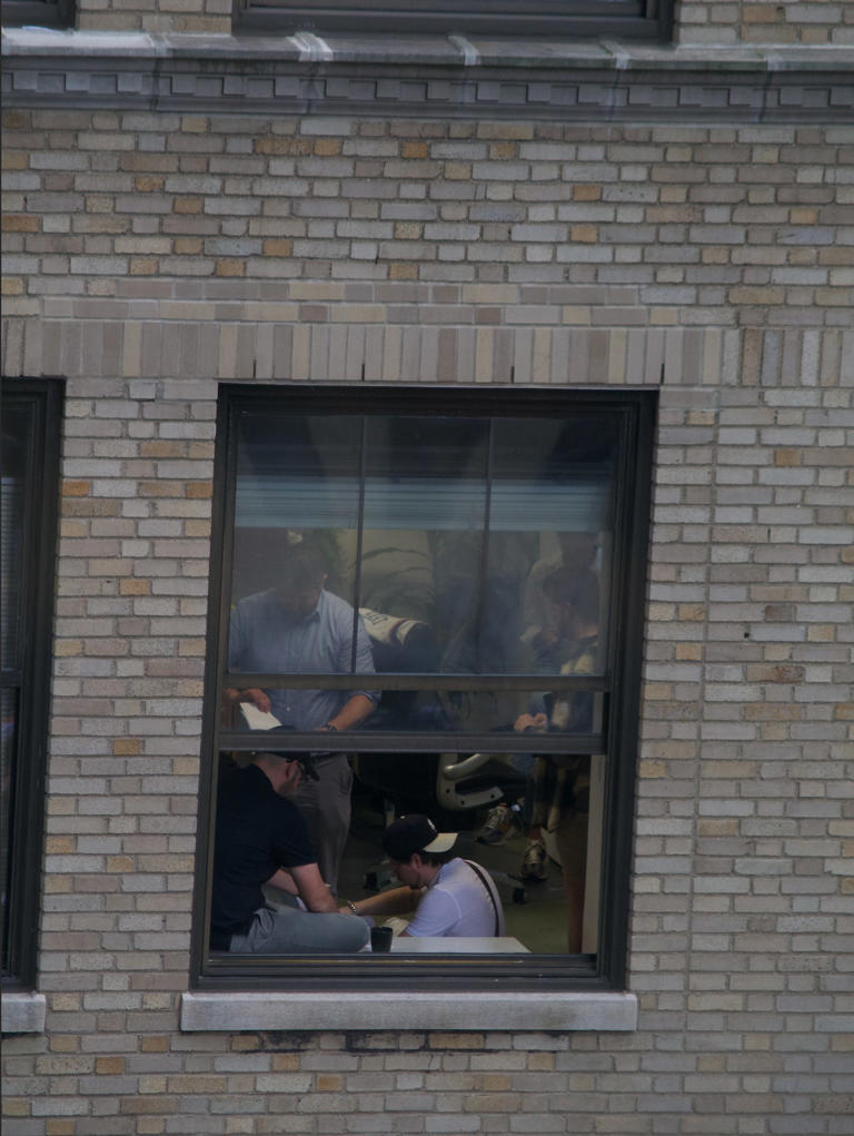 The hottest office perk in NYC today: a front-row view of the Knicks parade