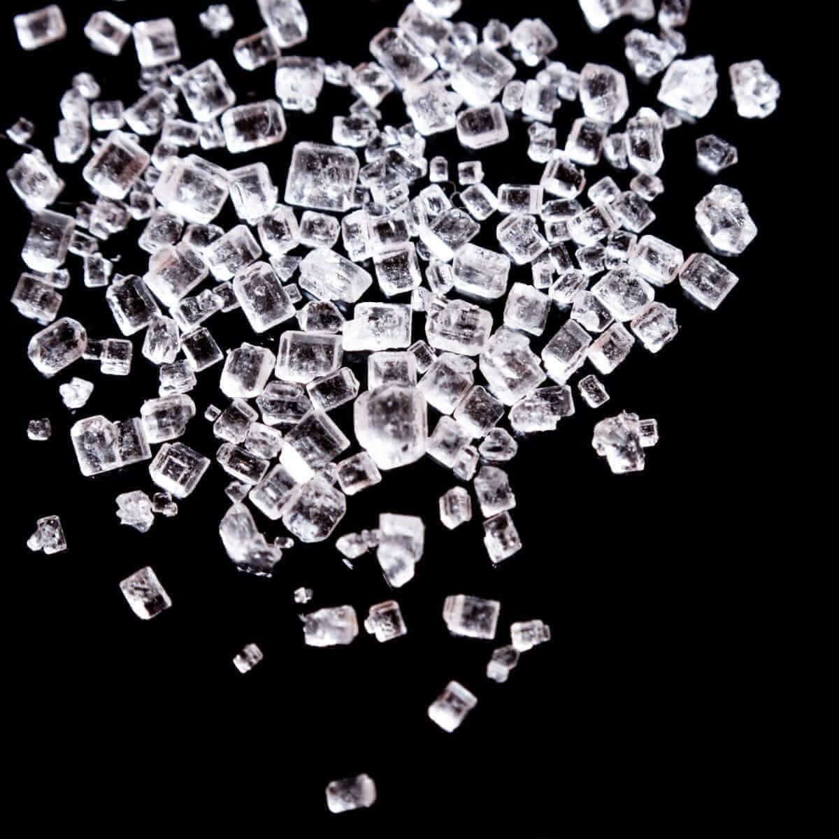 Sugar prices fall on dollar strength and crude oil weakness