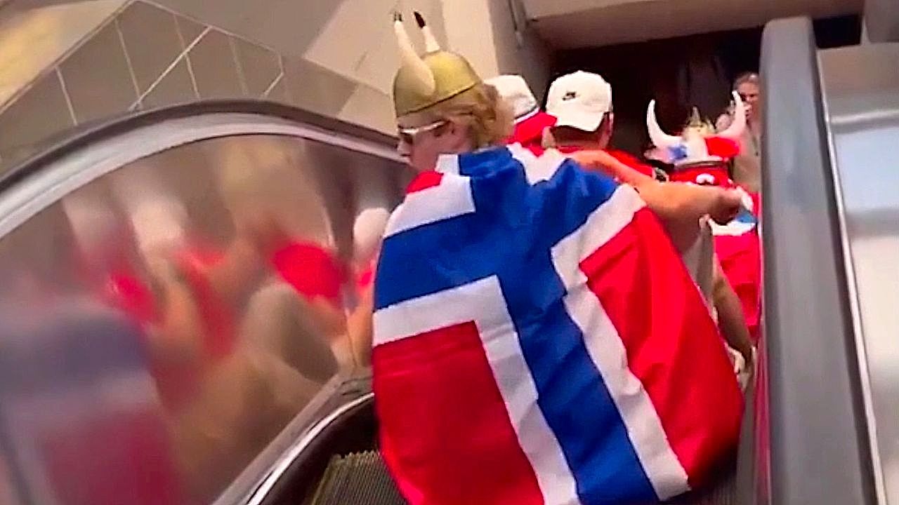Norwegian fans perform synchronized Viking row on Boston escalator