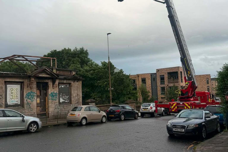 Emergency services swarm Edinburgh street amid ongoing building fire