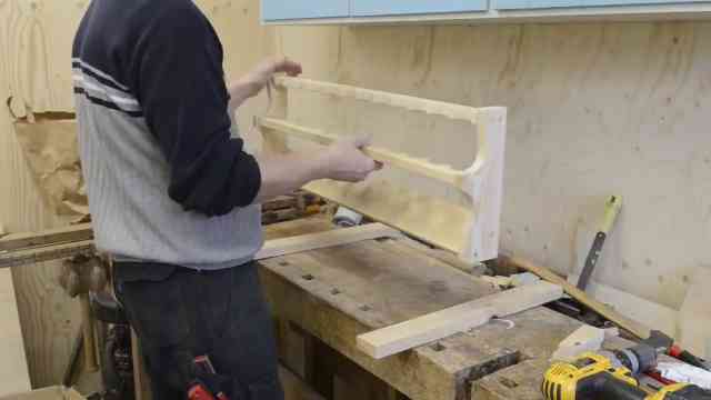 Watch this woodworker turn scrap boards into a tool rack for the shop