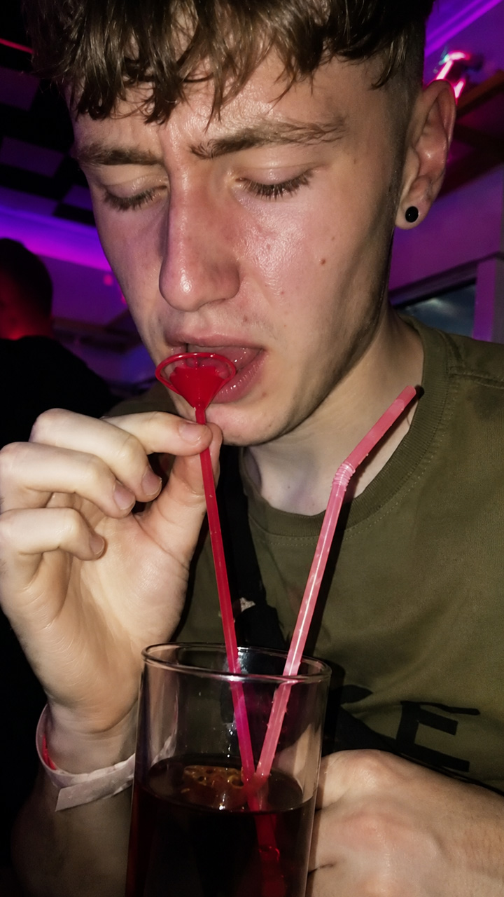 Friends turn an awkward drink moment into a quick laugh