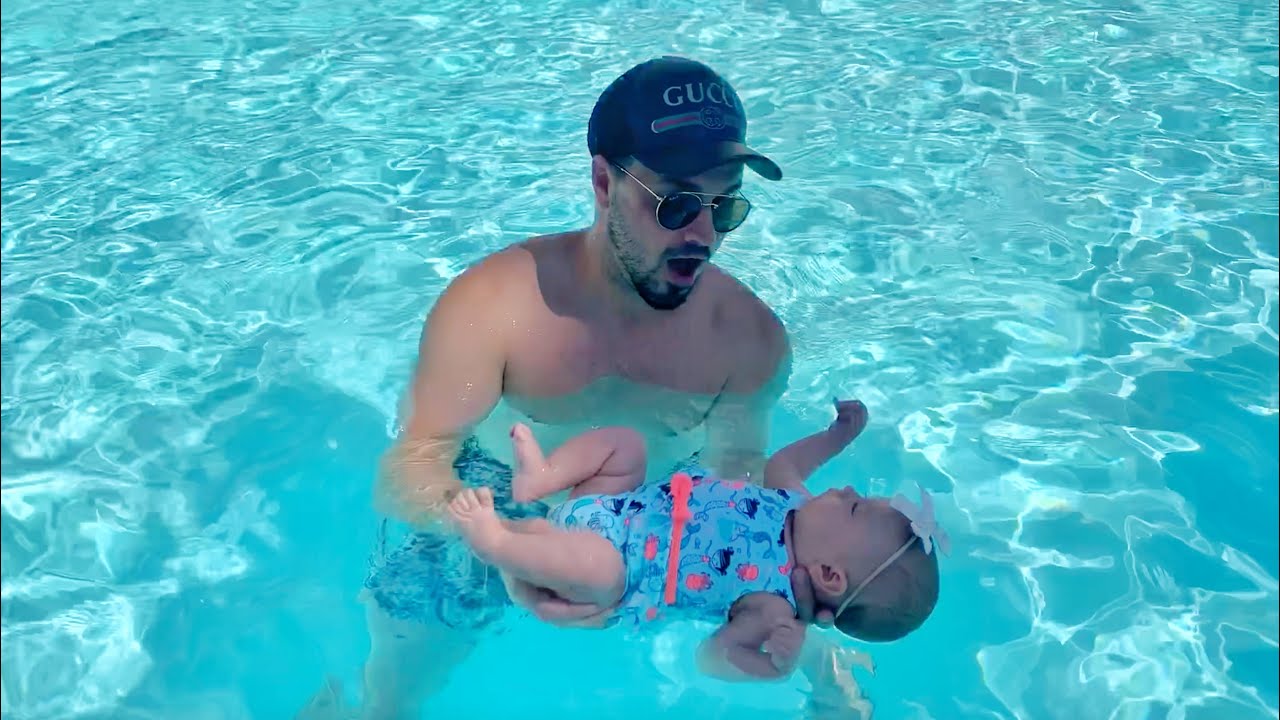 Watch an infant learn impressive swimming techniques on her own