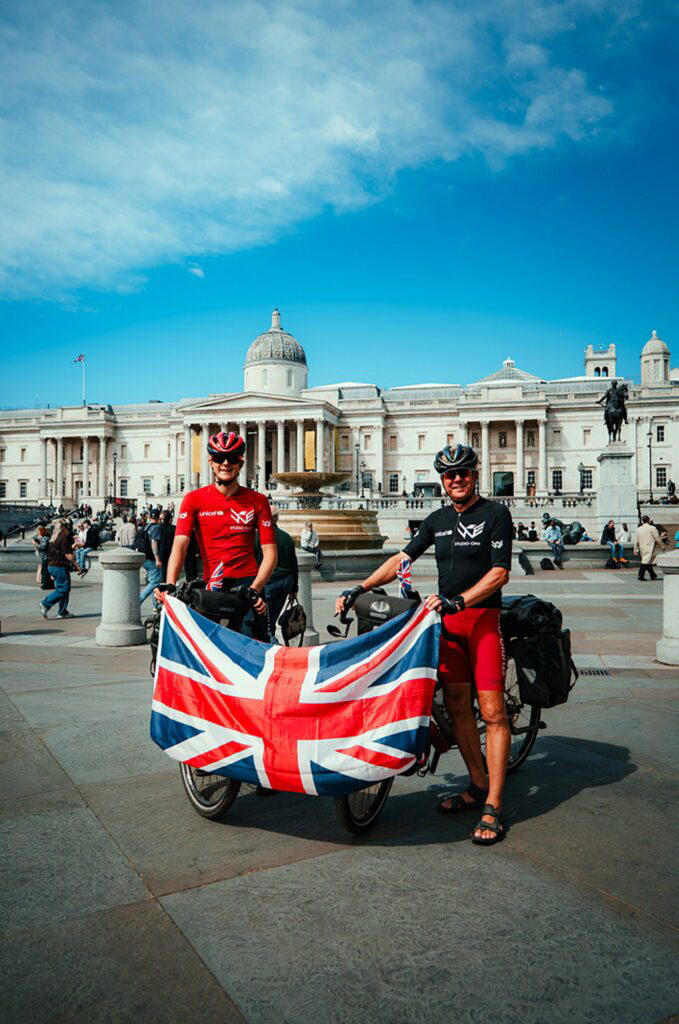 Father and son break world records after 18,000-mile cycle around the world