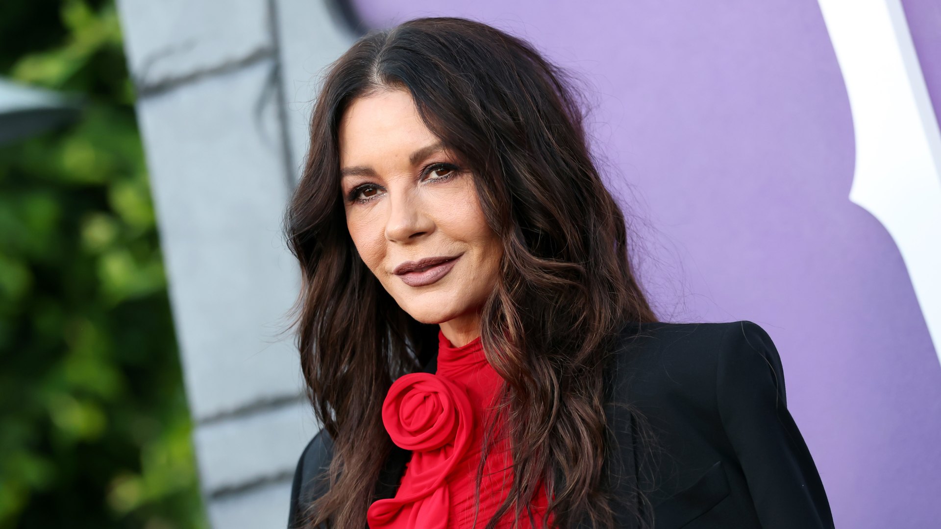 Catherine Zeta-Jones' cool, dressy sneaker style is perfect for events