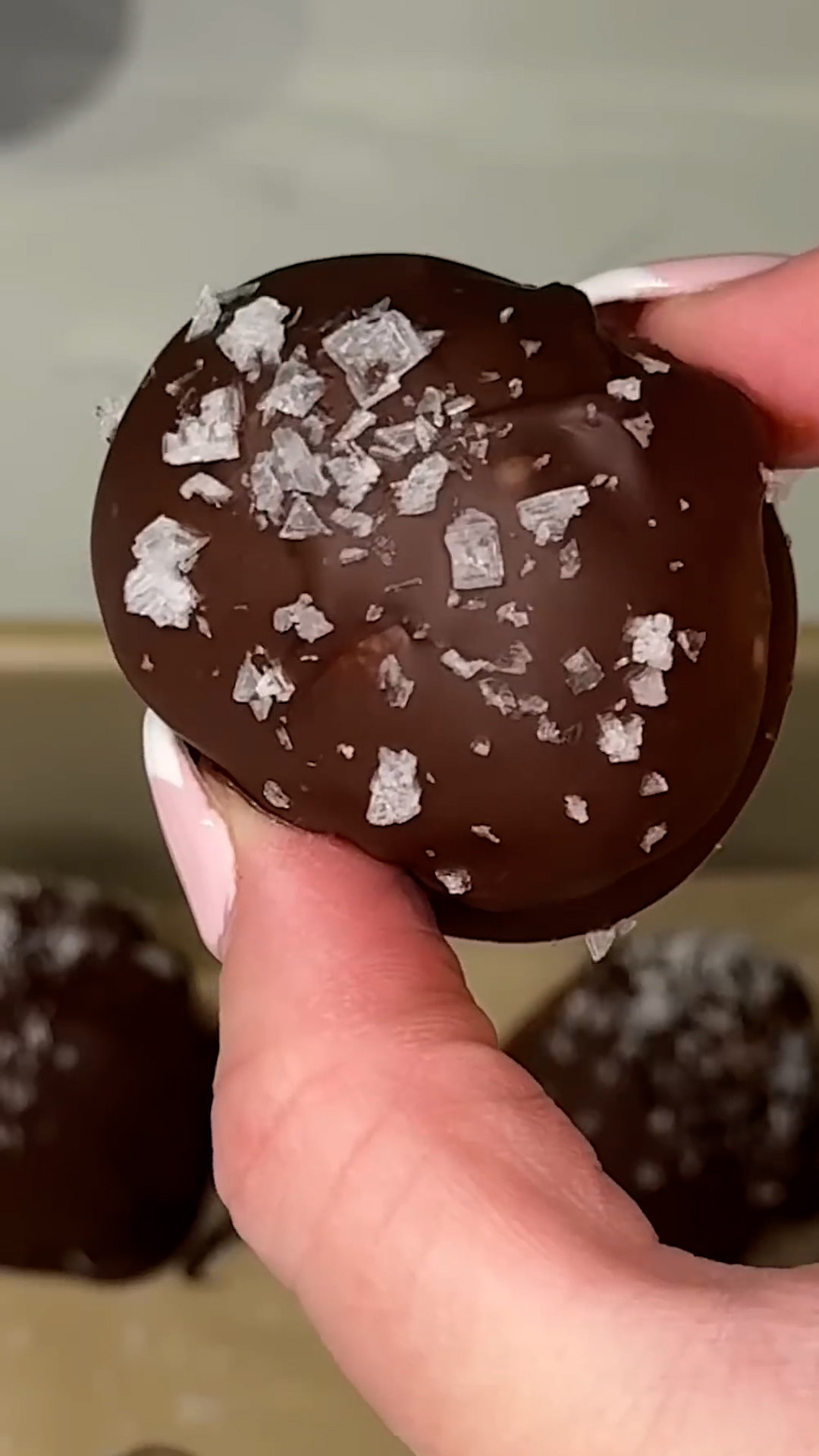 Edible cookie dough rolled into bite-sized chocolate-studded balls