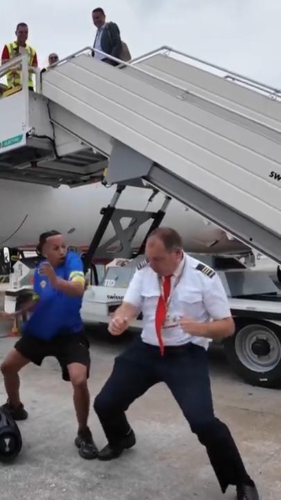 Pilot dances with Curacao player during joyful World Cup arrival