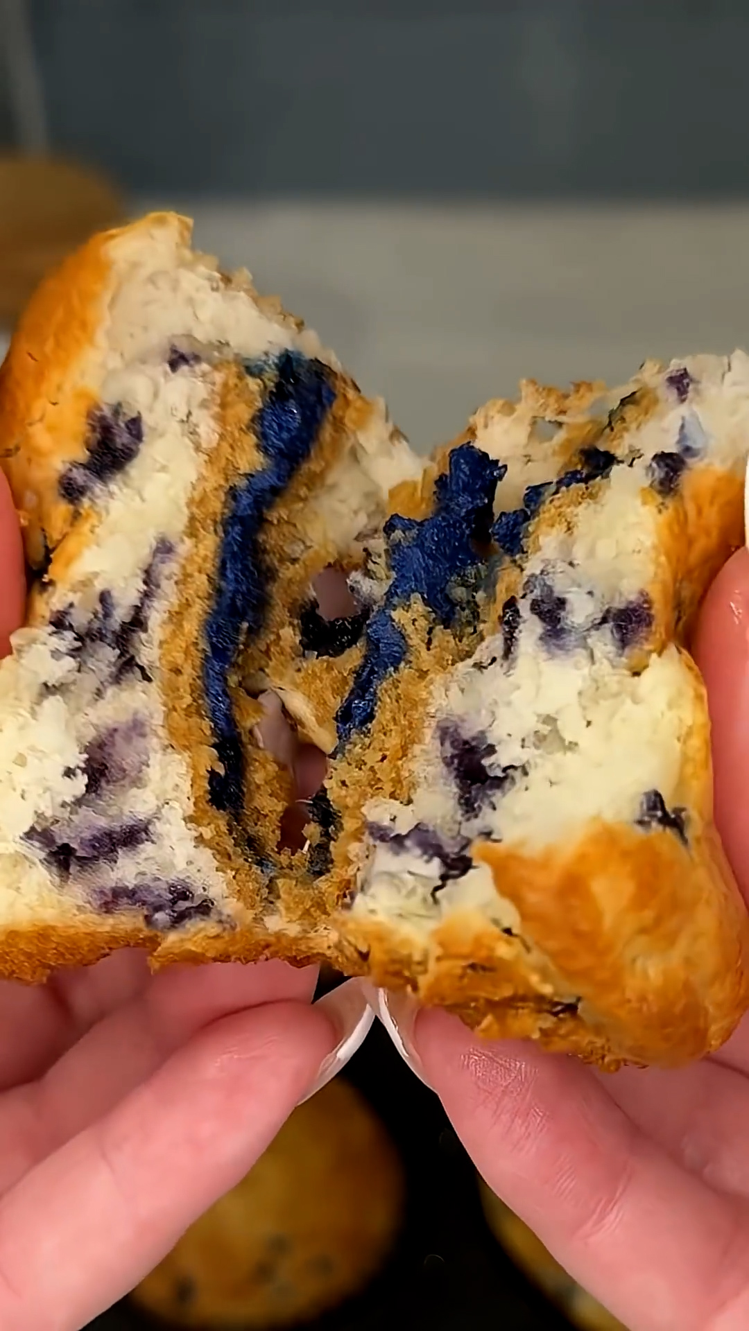 Blueberries and crushed cookies baked into soft sweet muffins