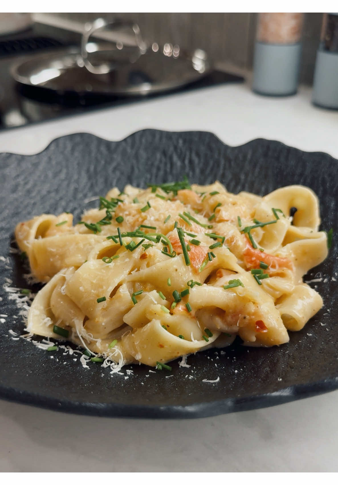 Creamy salmon pappardelle pasta with fresh chives and parmesan for an ...